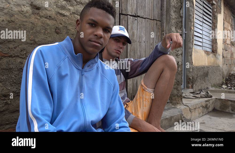 Two young Cuban men pose for camera in Trinidad Stock Video Footage - Alamy