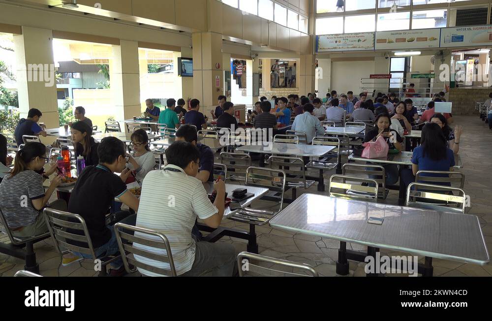 Students eat lunch in canteen National University of Singapore Stock ...