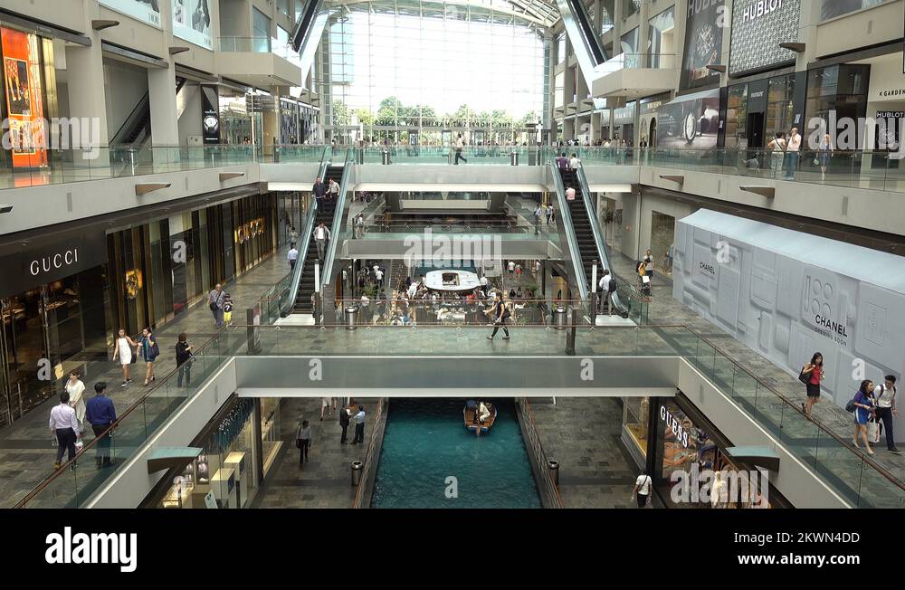 Gucci stores and gondola boat rides in shopping mall, tourism Singapore Stock Video Footage - Alamy