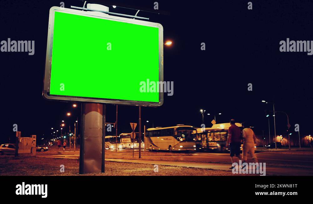 Blank green screen advertising billboard on street at night Stock Video ...