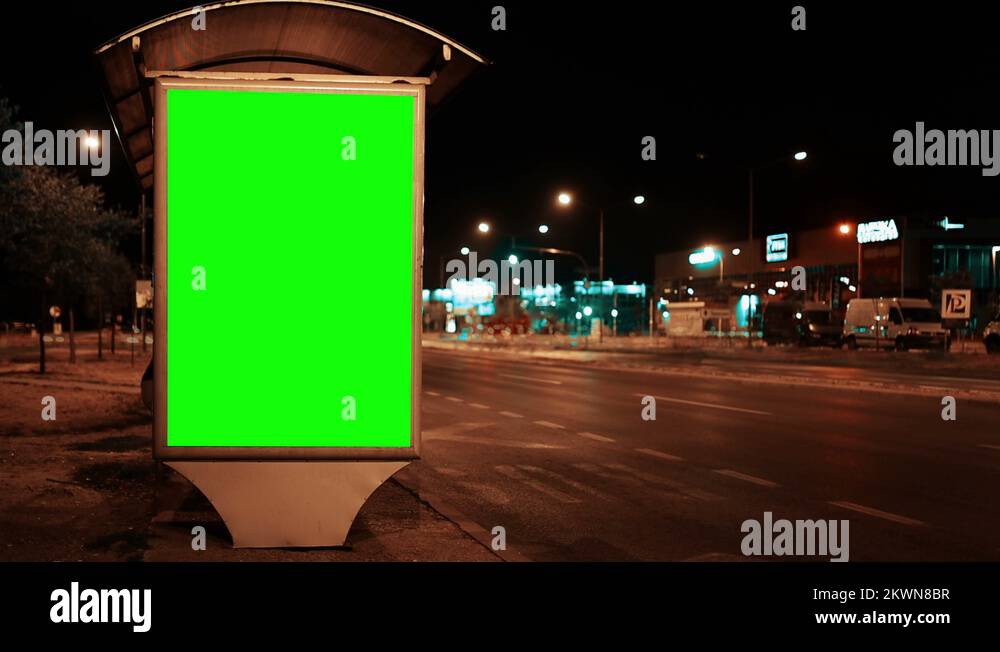 Blank green screen advertising billboard on street at night Stock Video ...