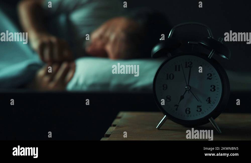 Man laying alone in bed at night Stock Video Footage - Alamy