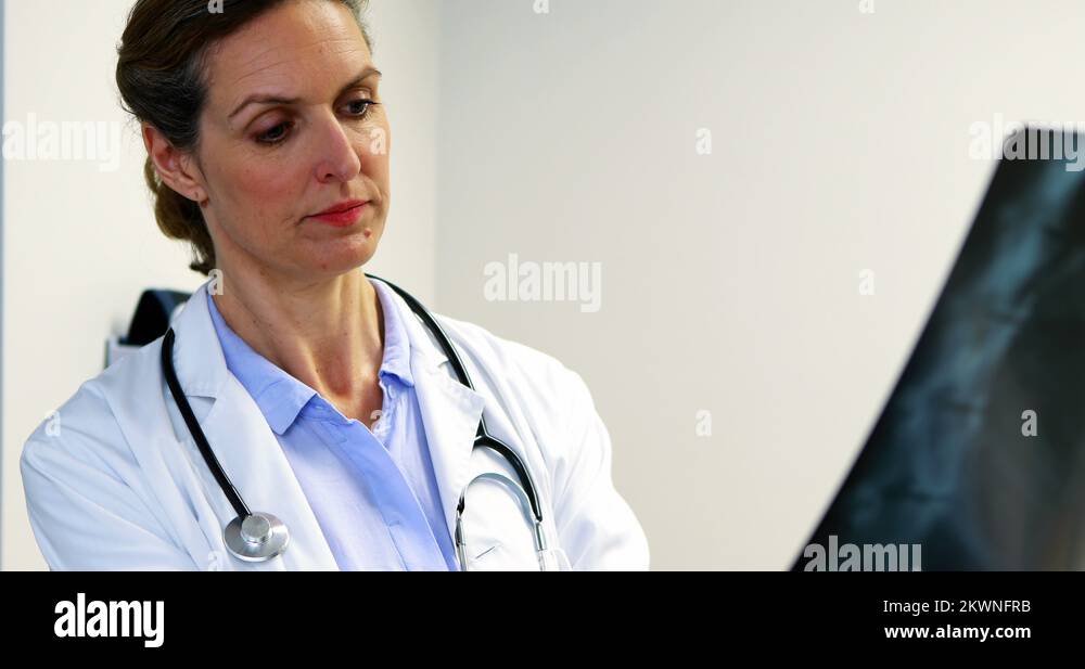 Female doctor examining an x-ray Stock Video Footage - Alamy