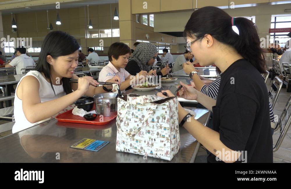 Female Asian students eat lunch in canteen National University of ...