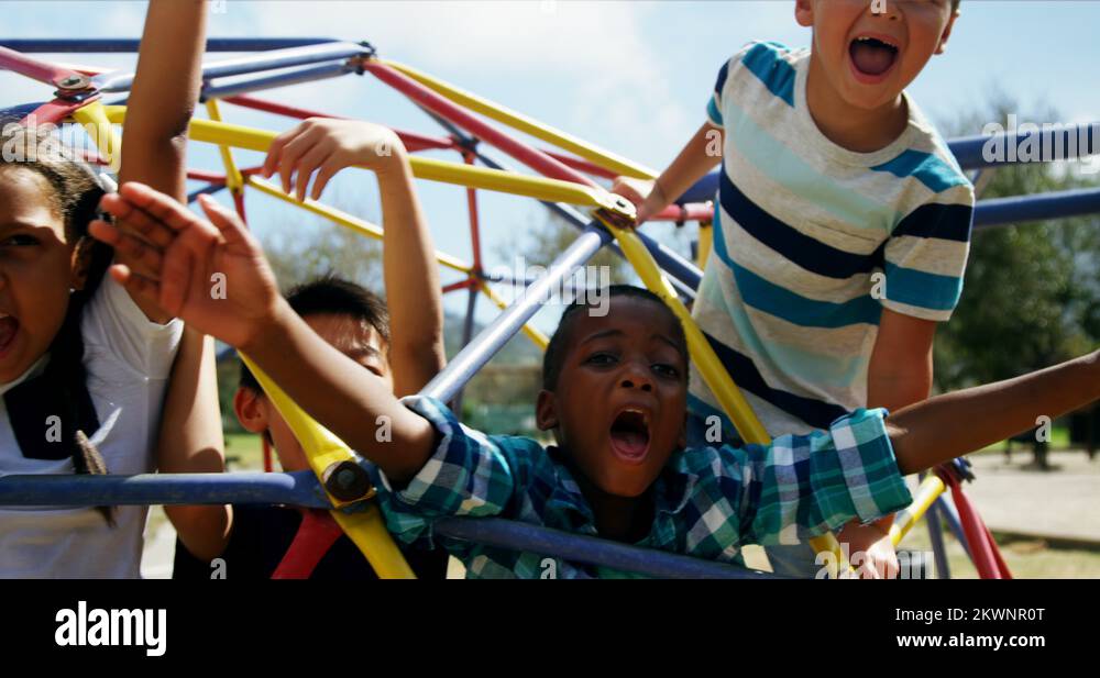 Happy schoolkids playing in playground Stock Video Footage - Alamy