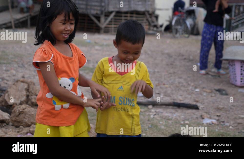 Cute Kids Playing On Street in Slums In Poverty Stock Video Footage - Alamy