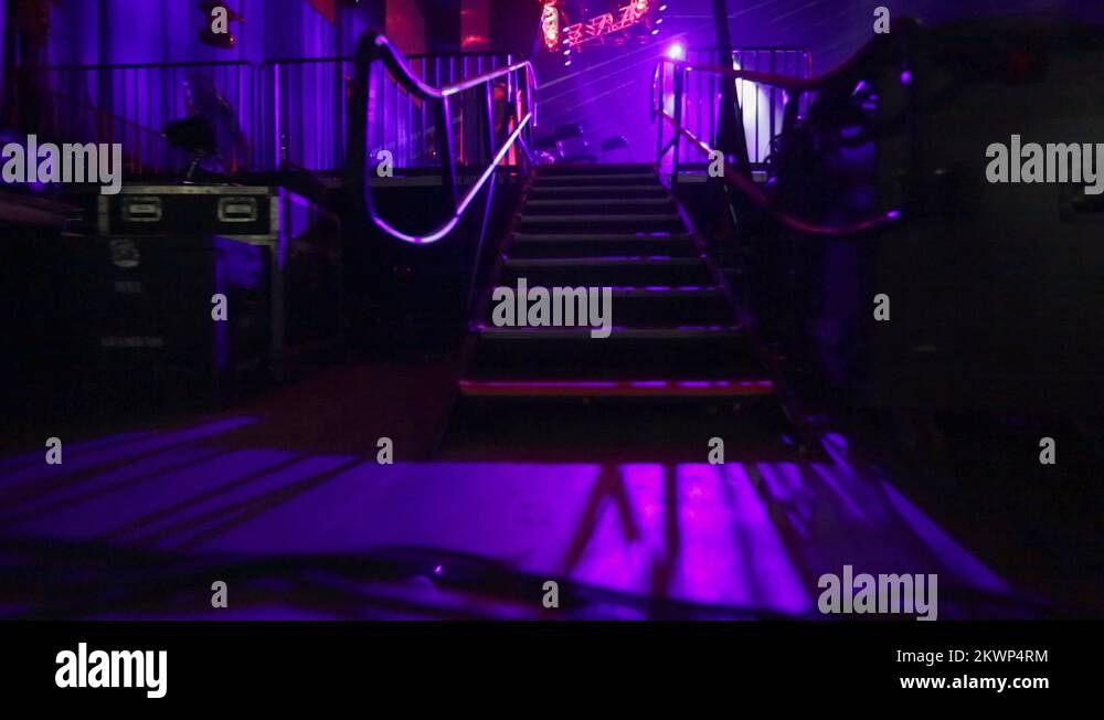POV of musician entering a stage through stairs for sound check before ...