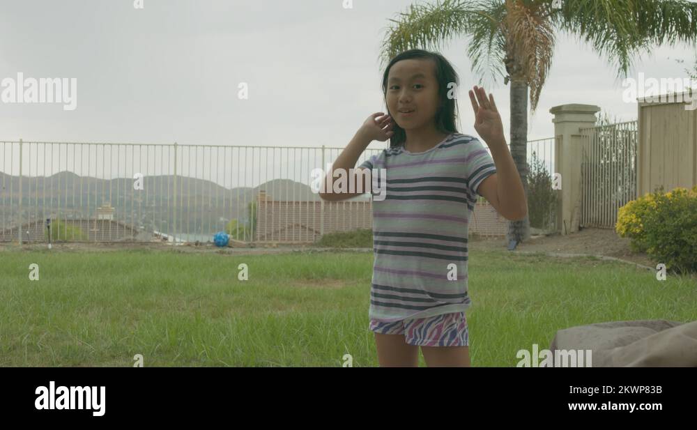 4K asian little girl kid ASL american sign language alphabet hand ...