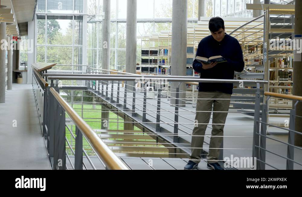 Man standing reading book Stock Videos & Footage - HD and 4K Video ...