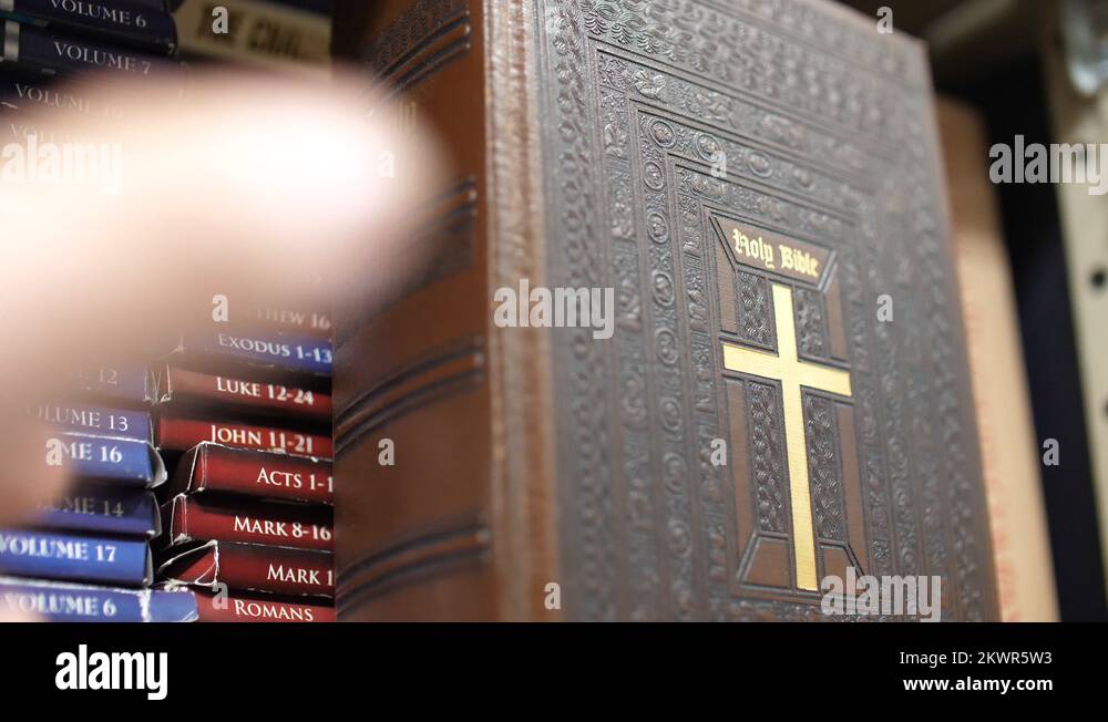 Old Antique Bible Gold Cross on Cover Pulling From Book Shelf, 4K Stock ...