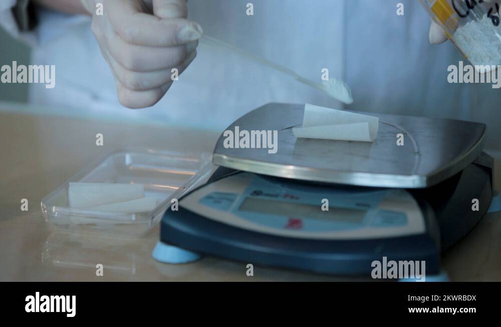 Measuring weight of ingredients in a chemist laboratory Stock Video ...