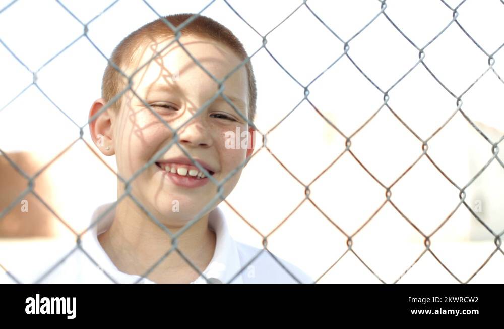 Boy behind the fence Stock Videos & Footage - HD and 4K Video Clips - Alamy