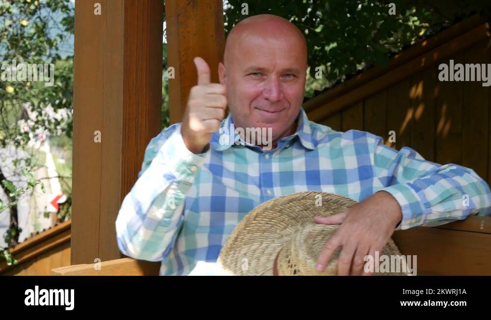 Farmer Enjoy Swinging in a Rocking Chair and Show Thumbs Up Hand ...