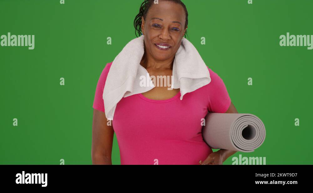 Woman poses for a portrait after her workout on green screen Stock ...