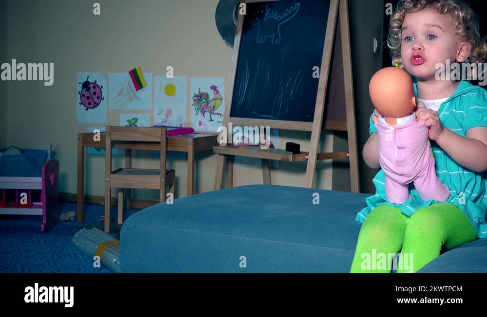 little girl telling story for her best friend baby doll Stock Video ...