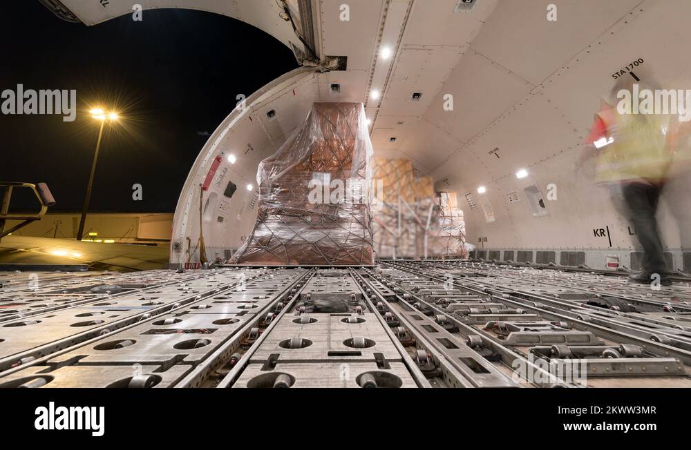 Loading air cargo freighter inside aircraft Stock Video Footage - Alamy