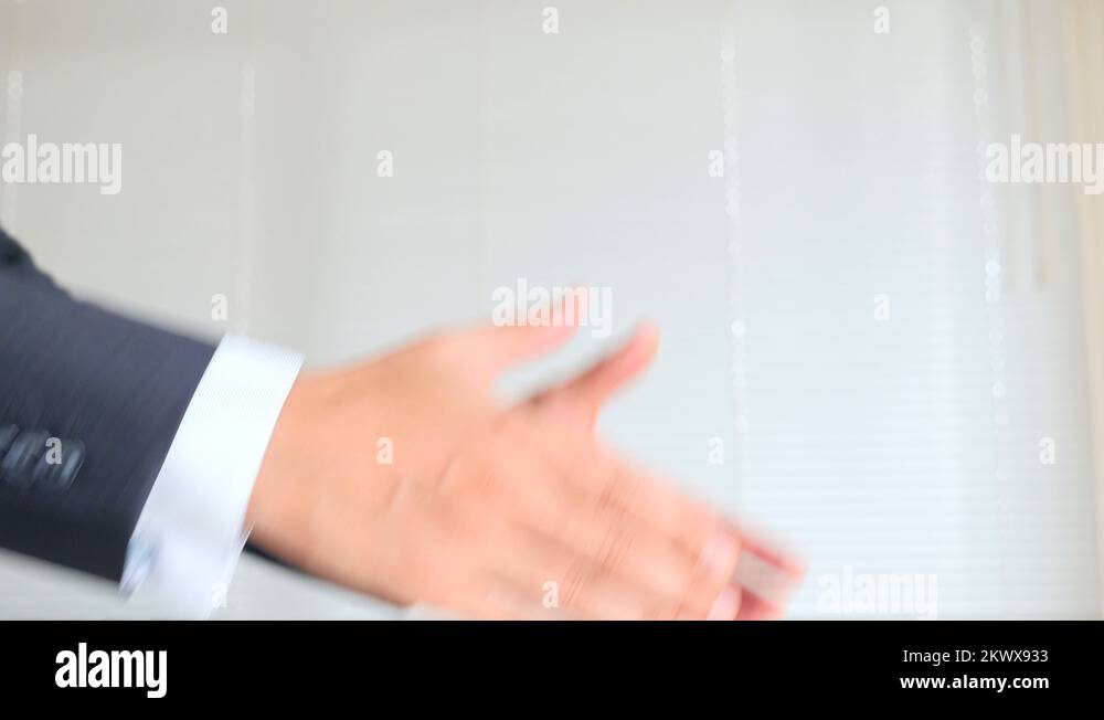 A Business Handshake. Two men shake hands. 4k, slow-motion Stock Video ...