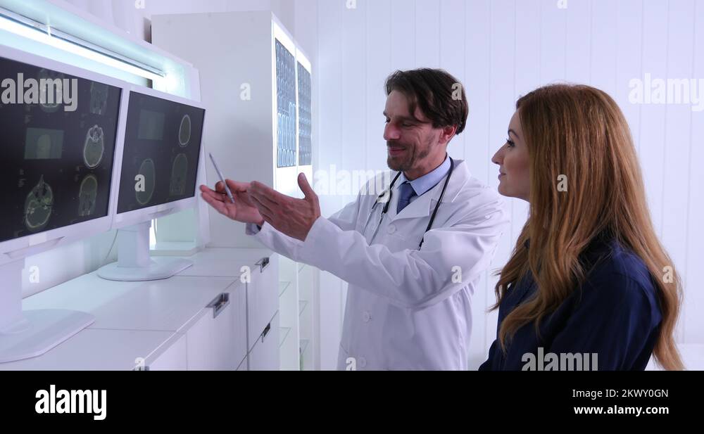 Senior Doctor Man Explain Patient Woman Positive Result on Brain MRI in ...