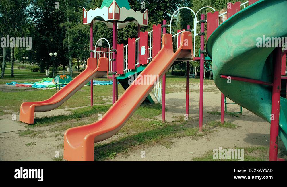 Child Sliding on a Slide in Park, Little Girl Playing at Playground ...