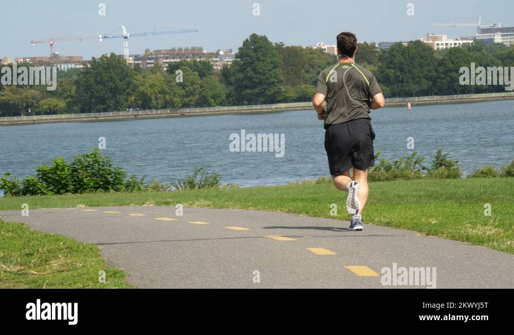 Man Running on Pathway Wearing Green Shirt Fit in Washington DC, 4K ...