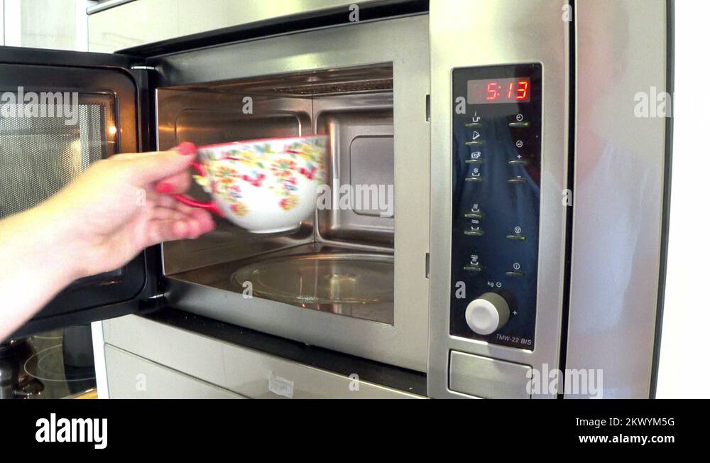 Using microwave oven Stock Videos & Footage - HD and 4K Video Clips - Alamy