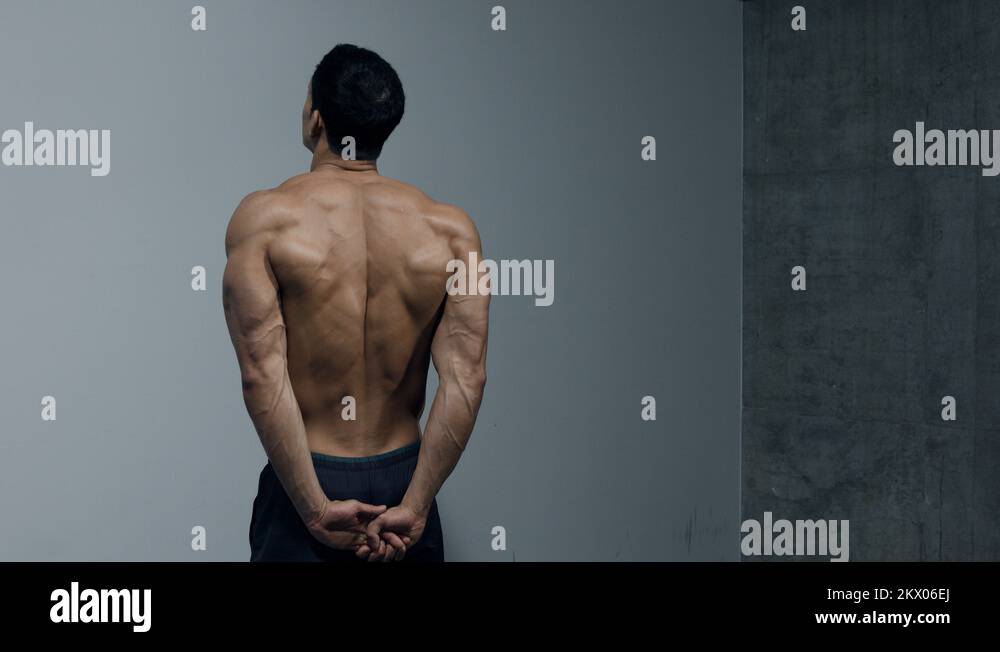 Fitness Model Flexing Back Muscles Stock Video Footage - Alamy