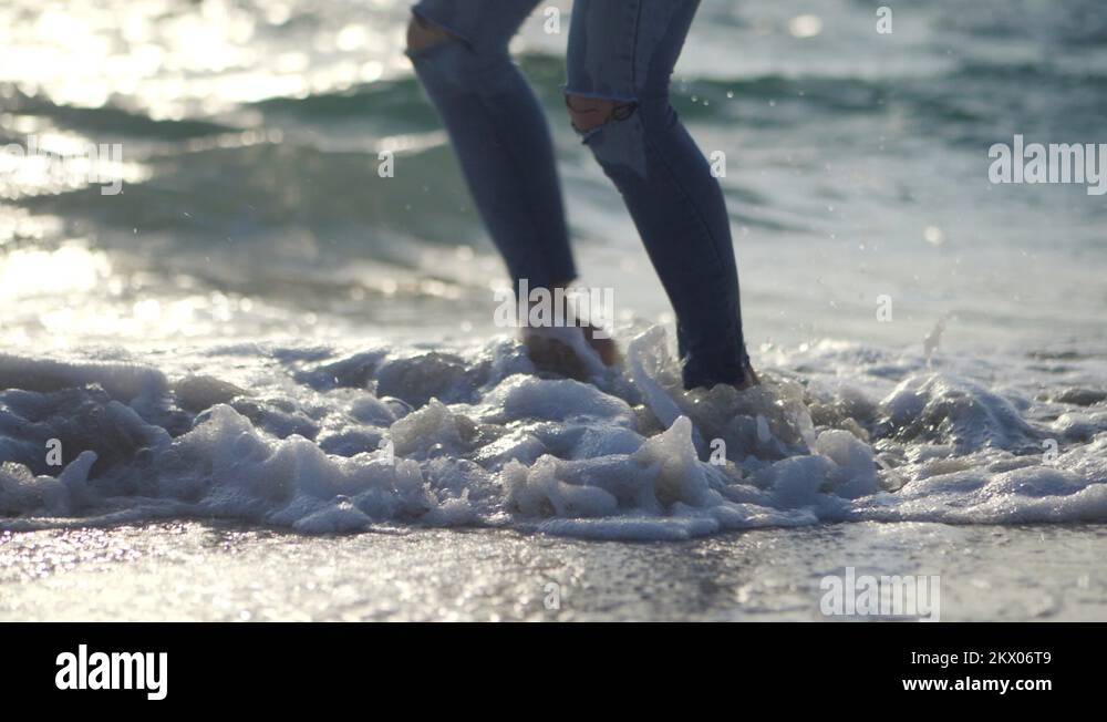 Close Up Of A Ballet Dancers Feet As She Practices Barefoot In Sea Or