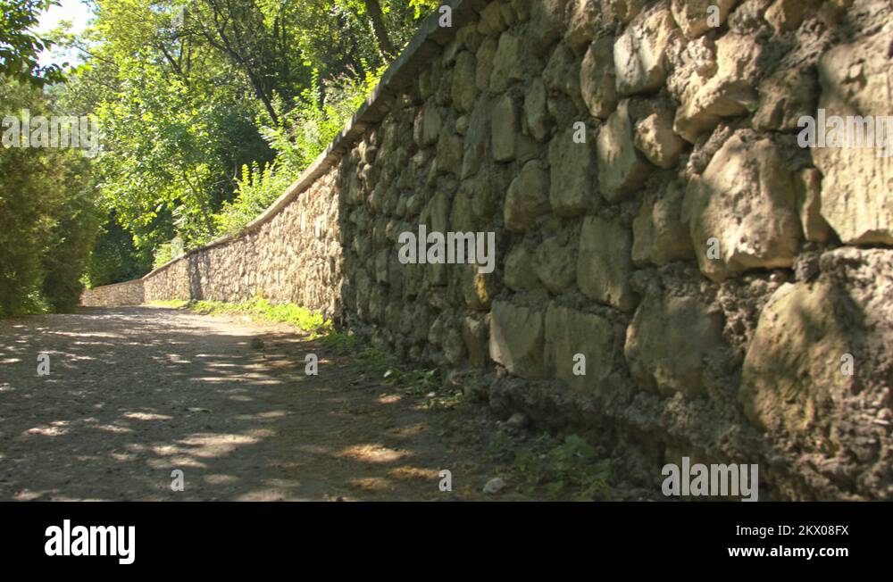 Road along a stone wall Stock Videos & Footage - HD and 4K Video Clips ...
