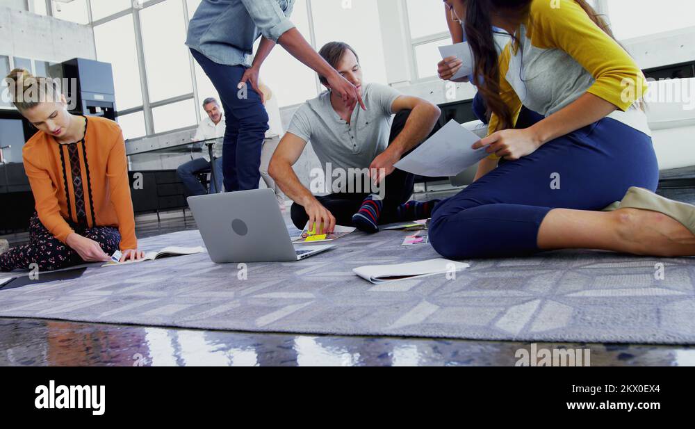 Attentive executive discussing over document 4k Stock Video Footage - Alamy