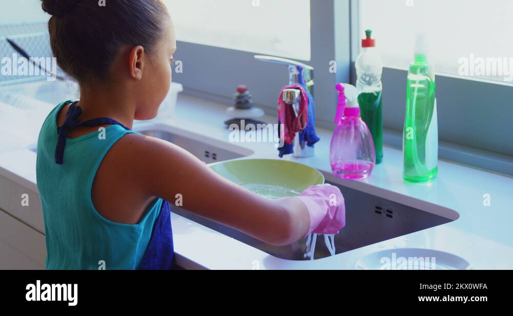 Cute little girl washing plate in kitchen sink 4k Stock Video Footage ...