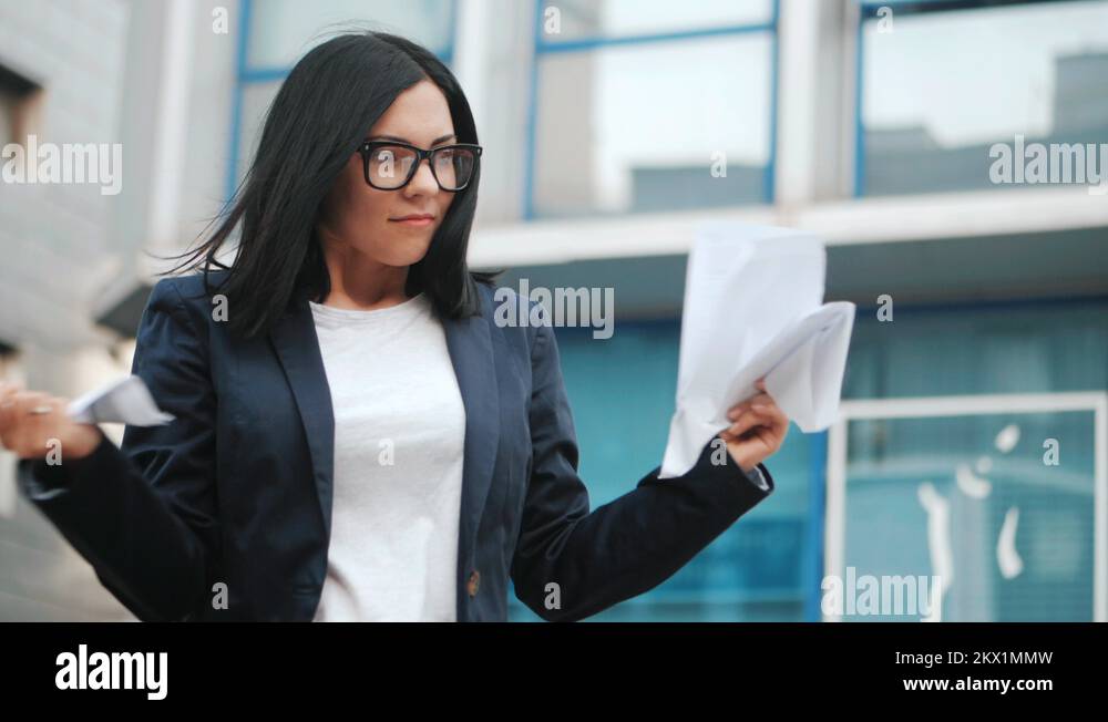 Angry furious female office worker throwing crumpled paper, having ...