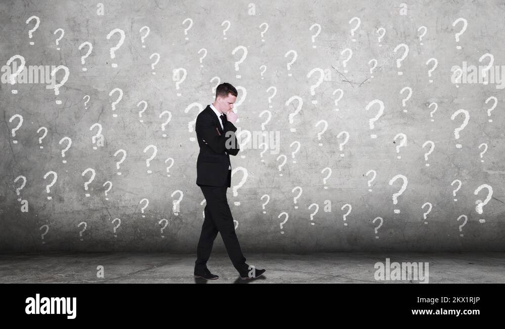 Confused businessman with question mark sign Stock Video Footage - Alamy
