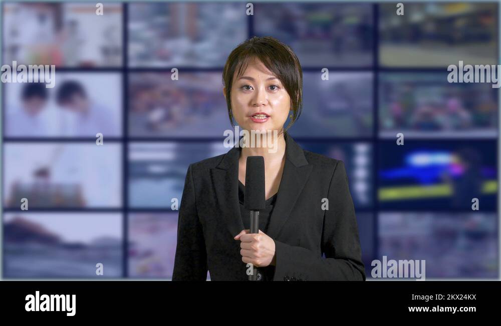 News anchor in TV studio with TV screens in background Stock Video ...