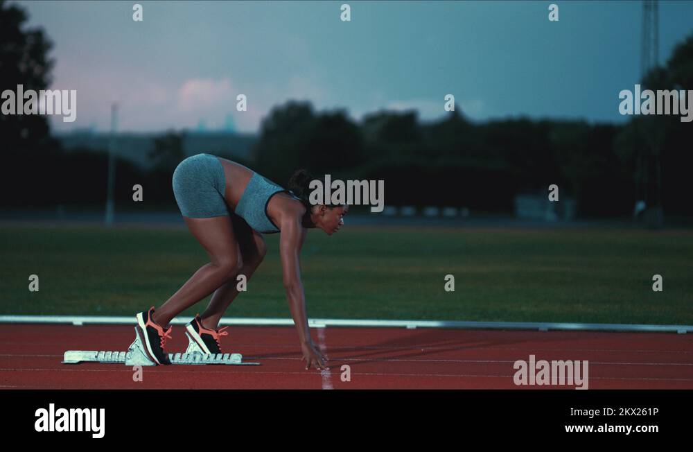 Female athletes training at running track, slow motion 1000fps Phantom ...