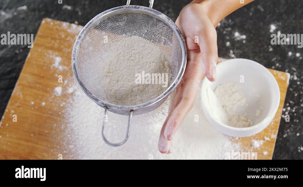 Woman sieving flour on Stock Videos & Footage - HD and 4K Video Clips ...