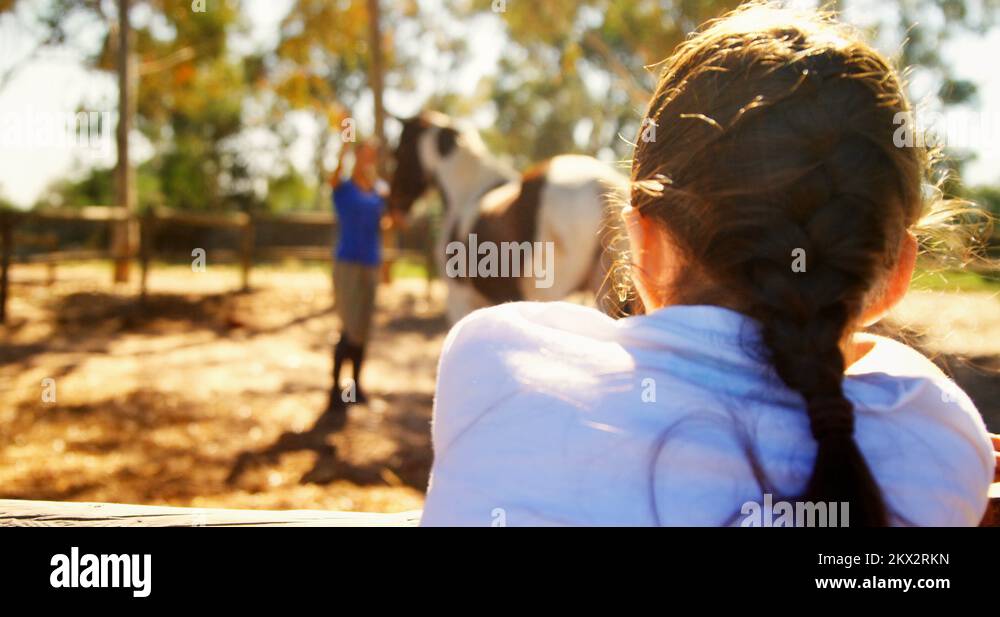Girl waving hand to her mother in ranch 4k Stock Video Footage - Alamy