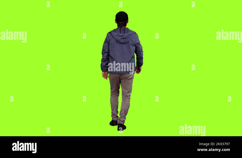 Back view of a male walks on green screen background, Chroma key Stock ...