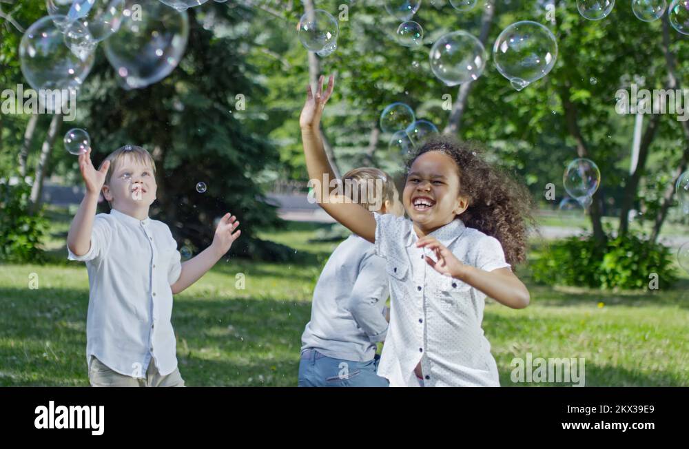Happy kids playing in park Stock Videos & Footage - HD and 4K Video ...