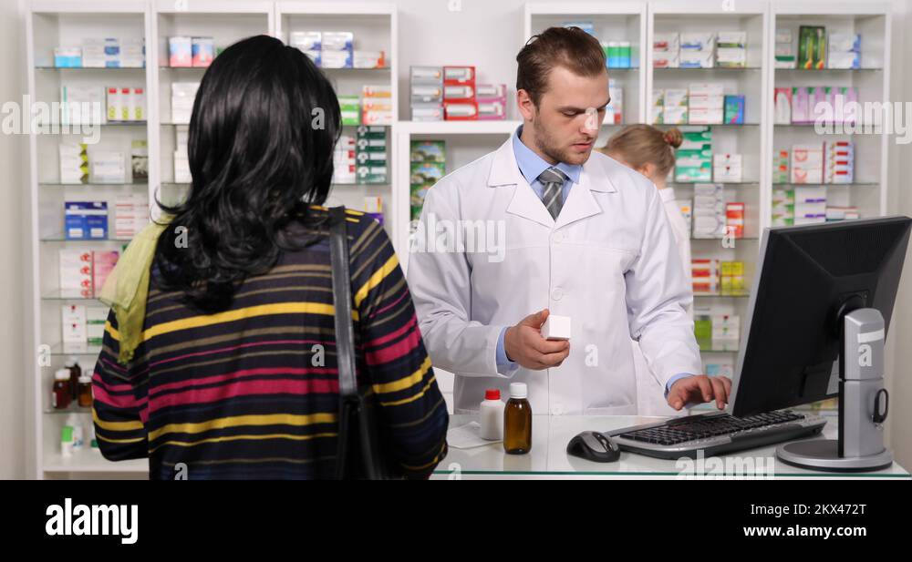 Pharmacist Man Council Talking to Client Woman about Pain Drug Pharmacy ...