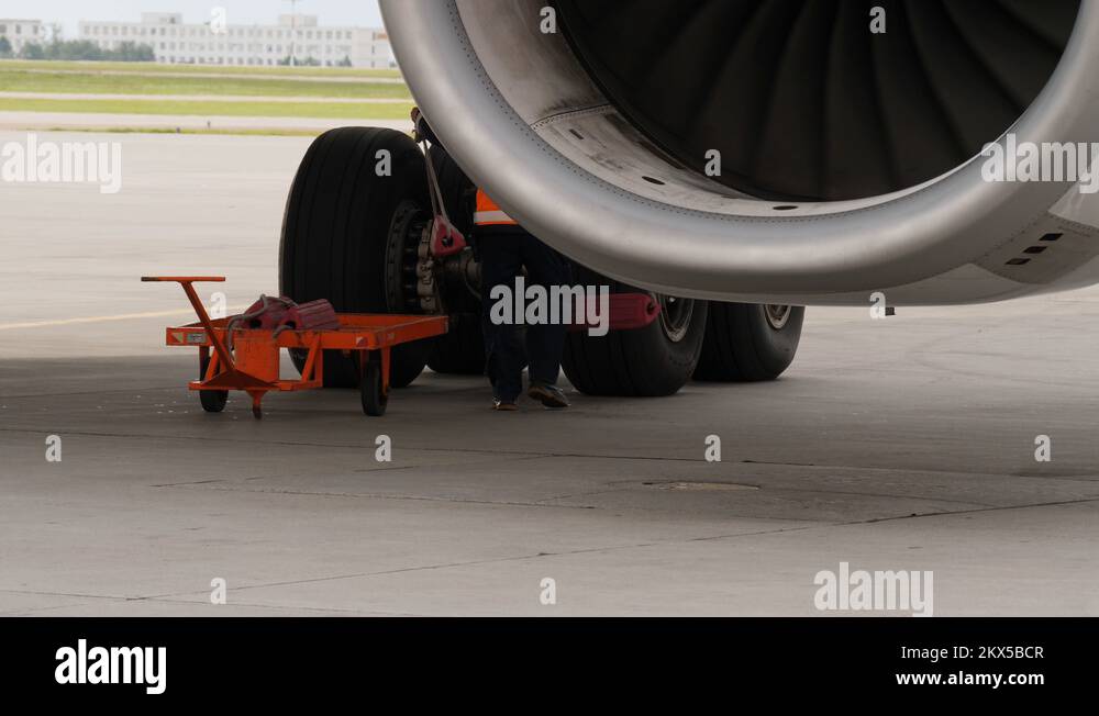 covid19. Ground crew places chocks under aircraft wheels flight ...