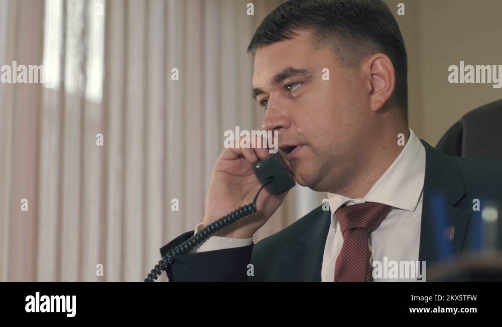 A Director of a company talking on the phone with his Secretary. 4K ...