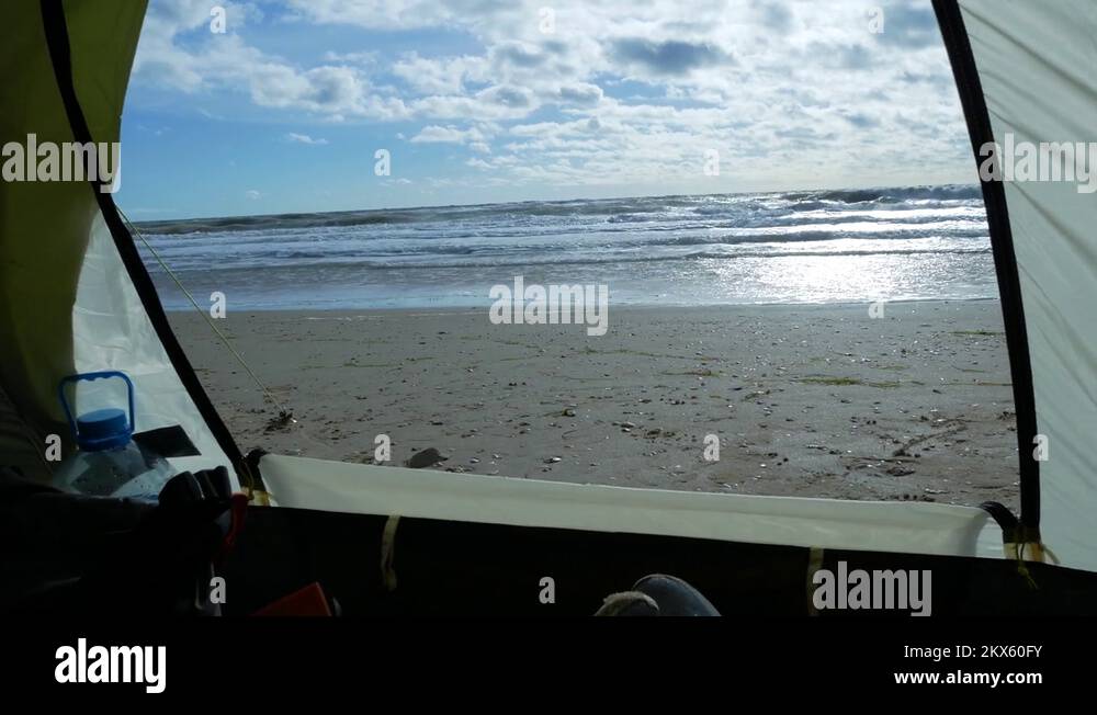 Tent on the beach. 4k. view from the tent on the sea. Sandy shore Stock ...