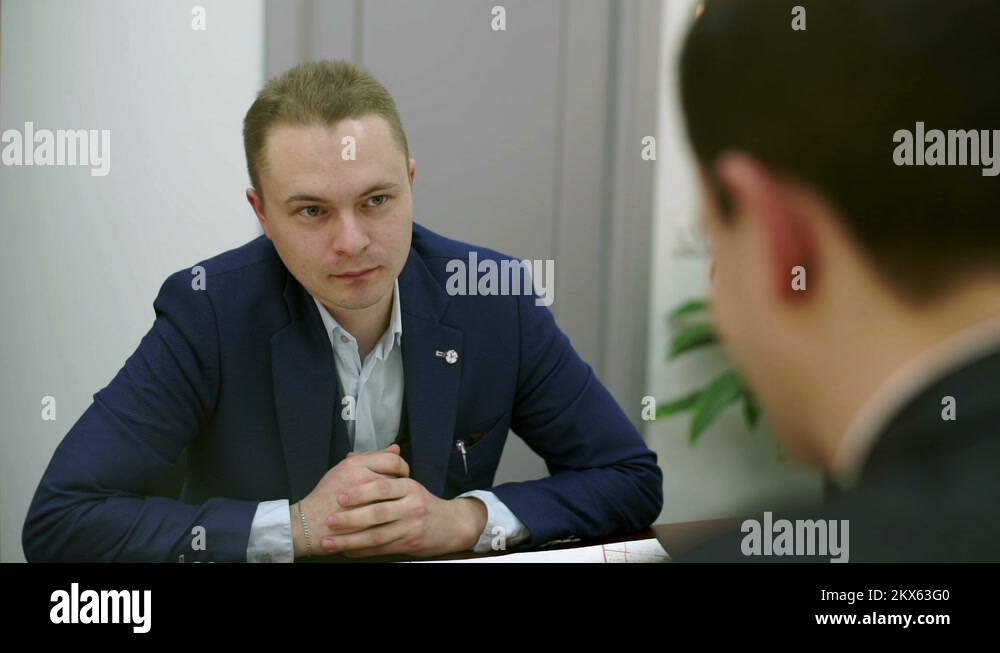 Guy looks around and smiles Stock Video Footage - Alamy