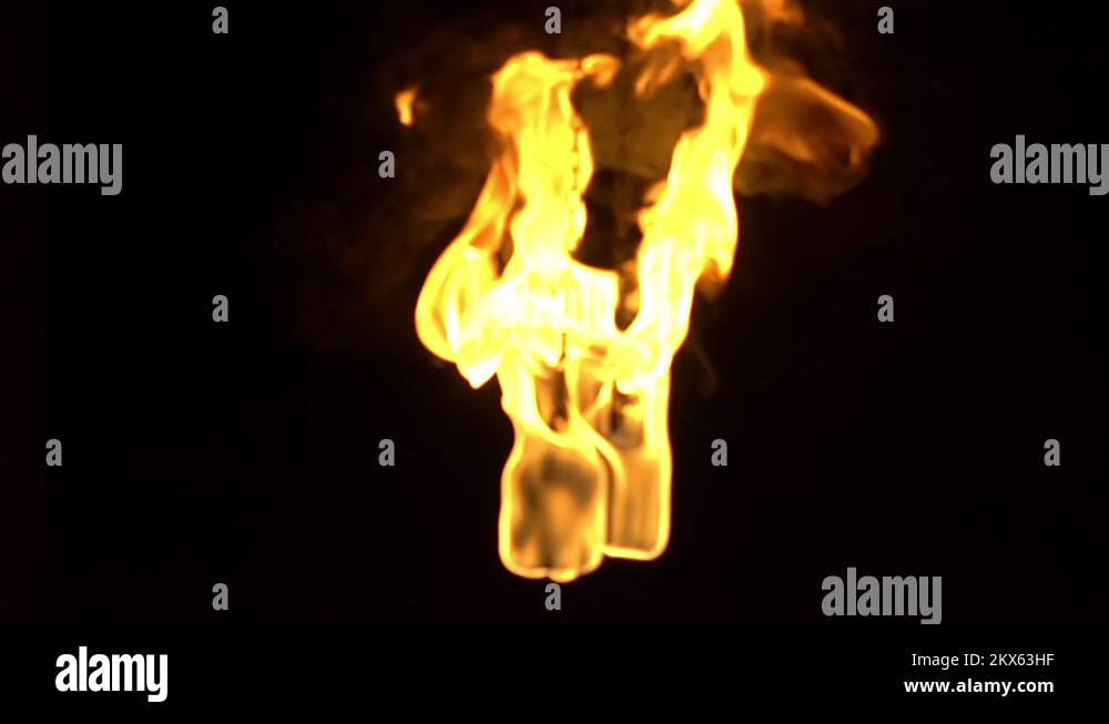 Slow Motion The Torch Is On The Chain On The Black Background Stock ... Slow Motion The Torch Is On The Chain On The Black Background Stock ...