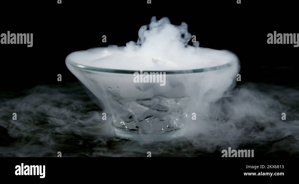 Ice smoke in bowl against black background 4k Stock Video Footage - Alamy