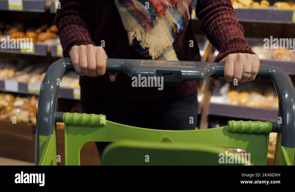 Woman pushing shopping cart in grocery store. 4k Stock Video Footage ...