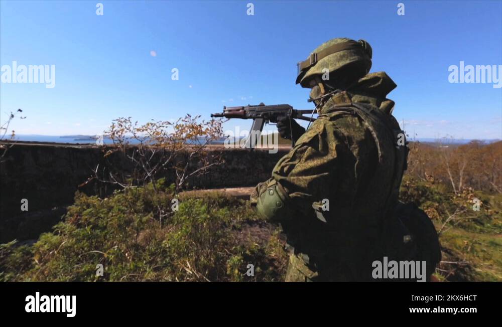 Reloading of AK sub machine gun. Soldier in modern uniform Stock Video ...