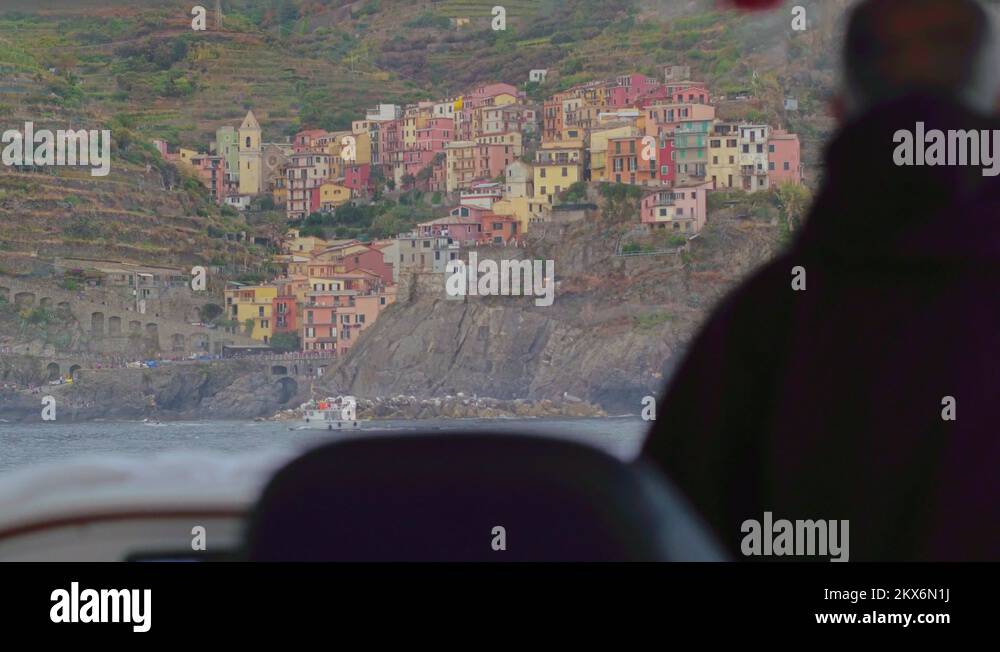 Captain steering sailboat during sea walk past coast Cinque Terre Italy ...