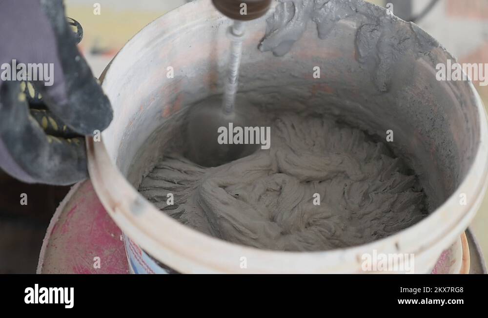 Mixing cement for the preparation of Construction Stock Video Footage ...