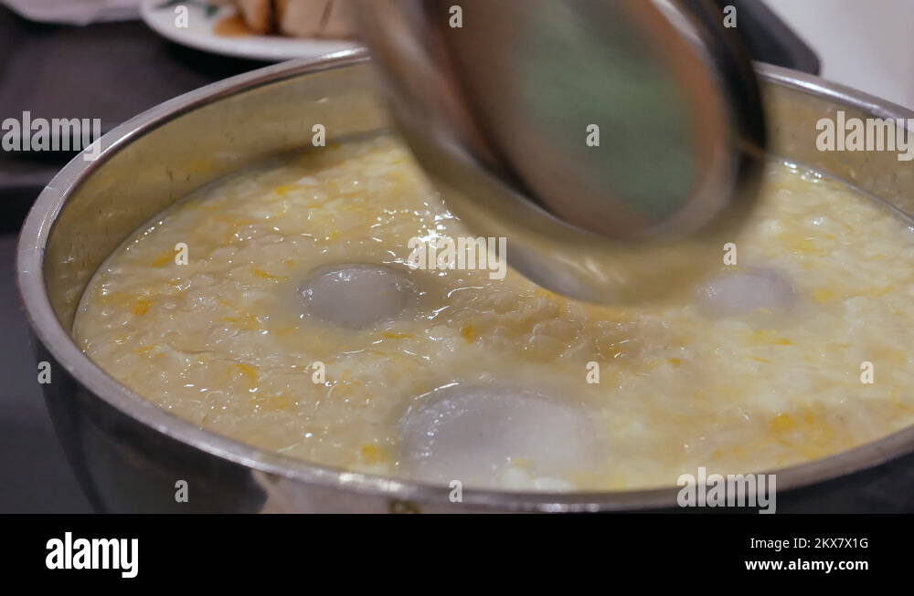 Motion of people eating sesame rice balls at food court area Stock ...